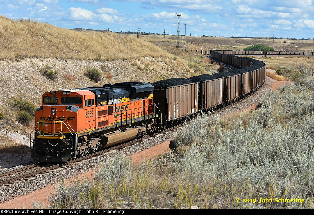 BNSF 8562 (SD70ACe) rear DPU on an east bound unit coal train leaving East Guernsey WY. 10/5/2019